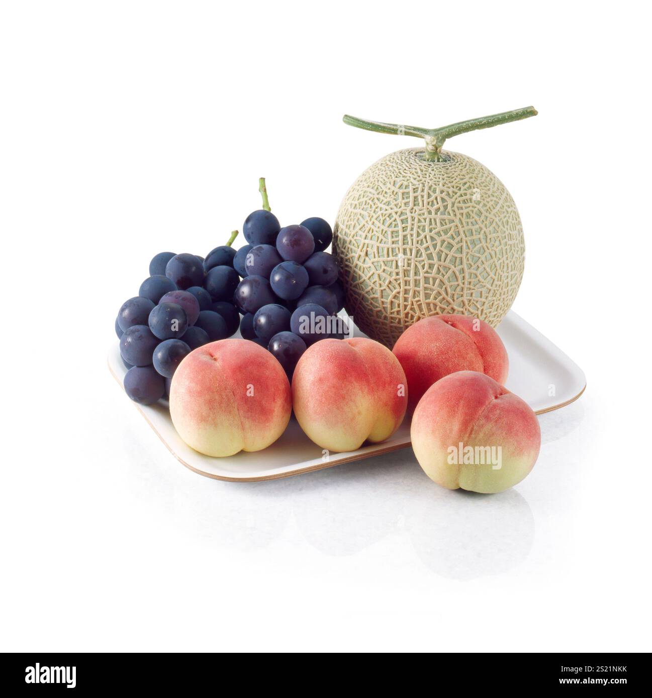 Melon, grape and peach Stock Photo - Alamy