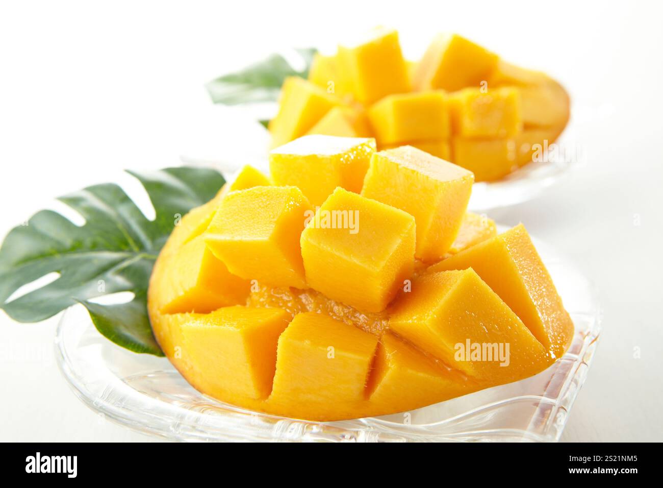 Mango cubes cut Stock Photo - Alamy