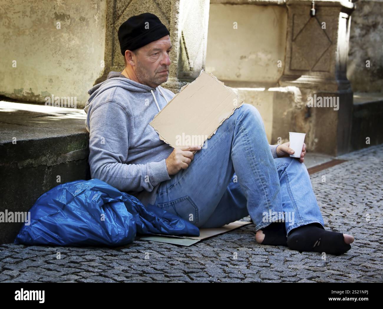 An unemployed beggar is homeless and hungry Austria Stock Photo - Alamy