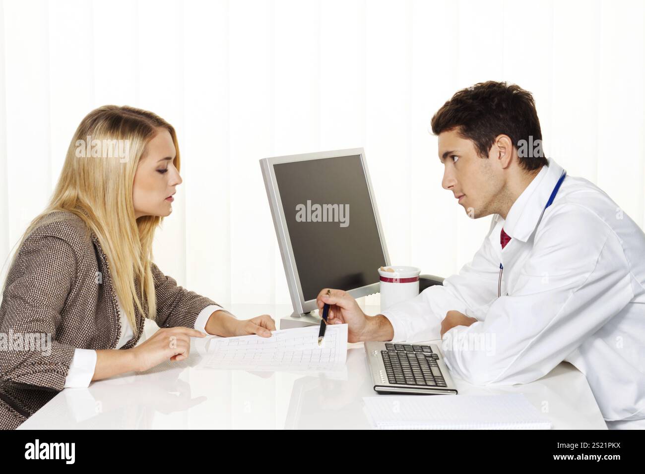 Conversation with a doctor. Patient and doctor talking in a doctor's ...