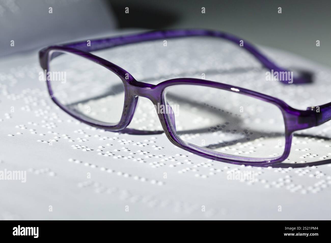 Glasses and a Braille book. Reading with a disability. Austria Stock ...