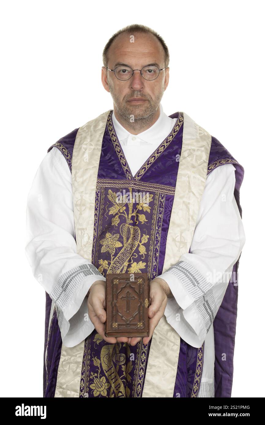 A Catholic priest with a Bible in a church service Austria Stock Photo ...