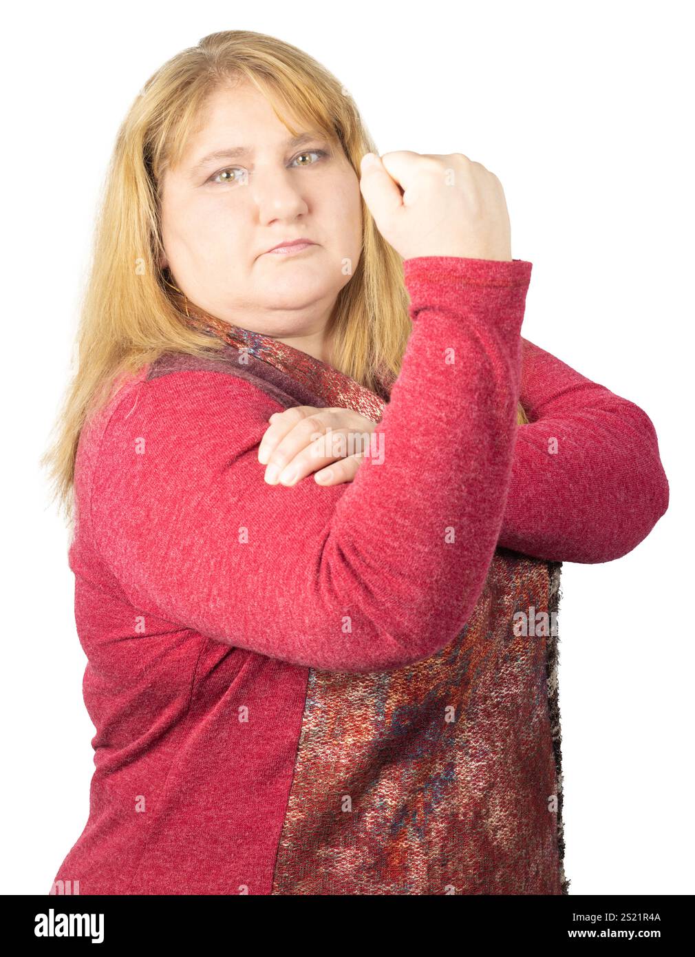 A woman with long blonde hair poses with a strong and determined ...