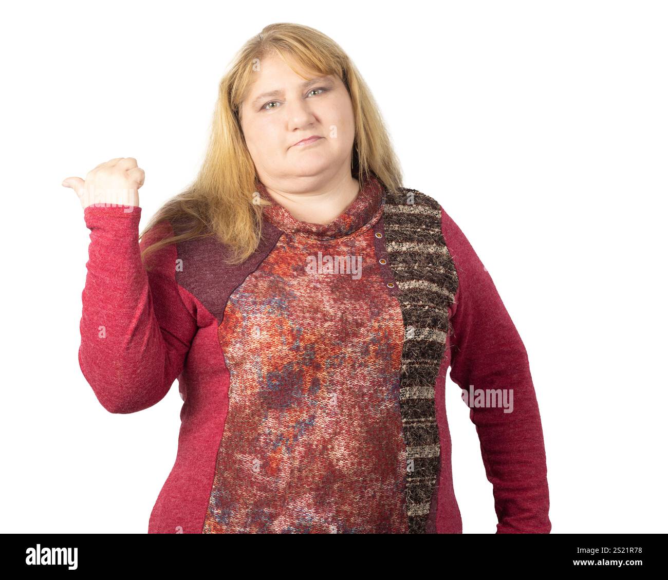 A woman with long blonde hair is posing in a studio, gesturing with her ...