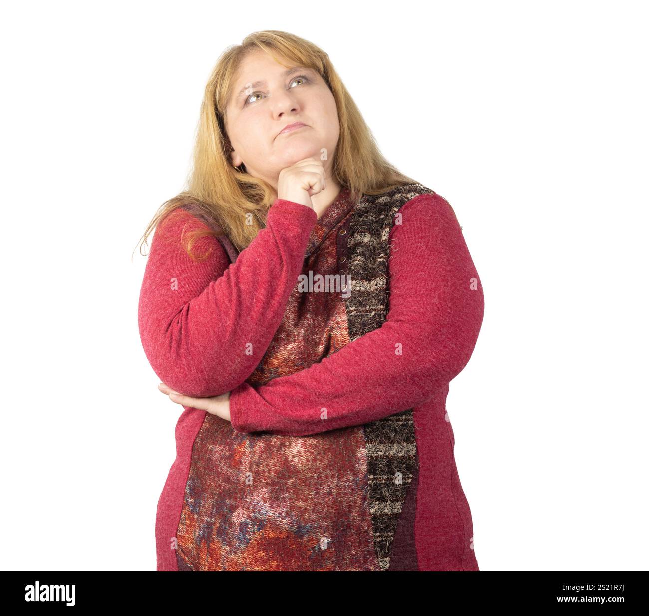 A woman with long blonde hair poses thoughtfully with her hand on her ...
