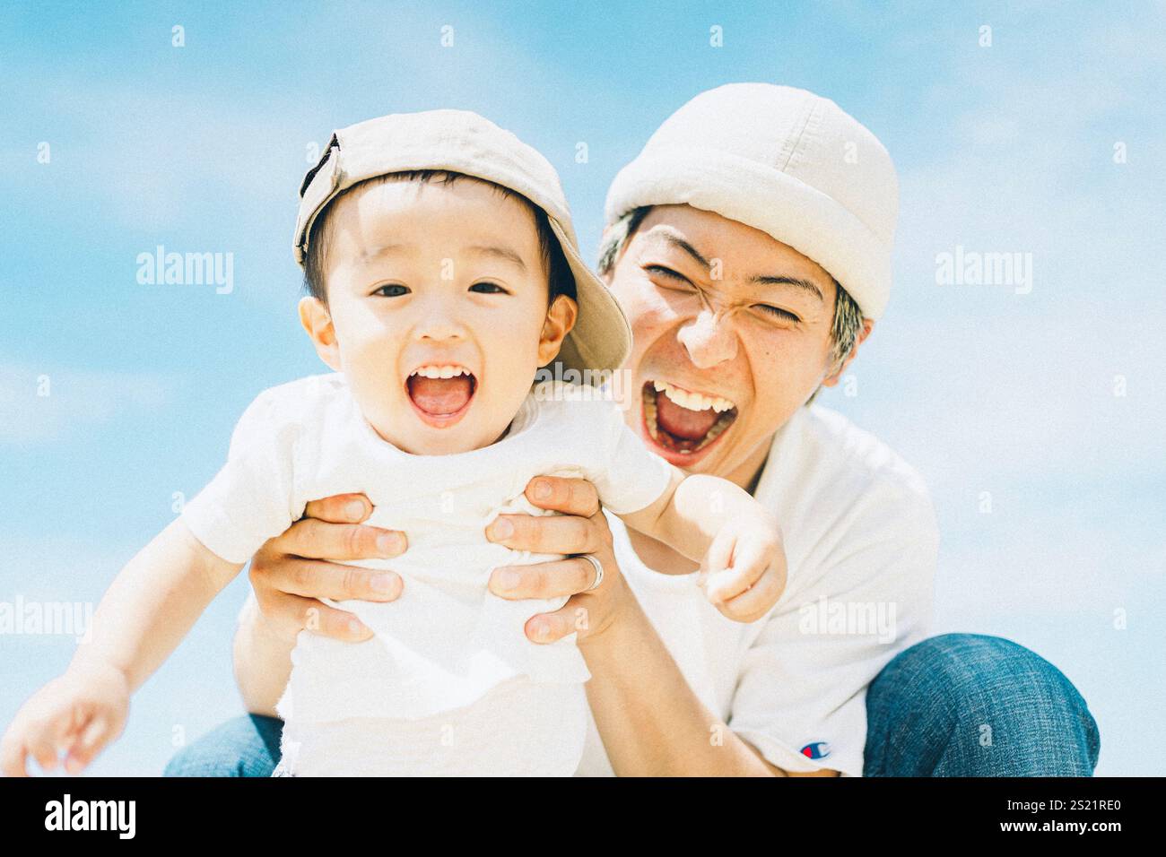 Parent and child getting along outdoors Stock Photo - Alamy