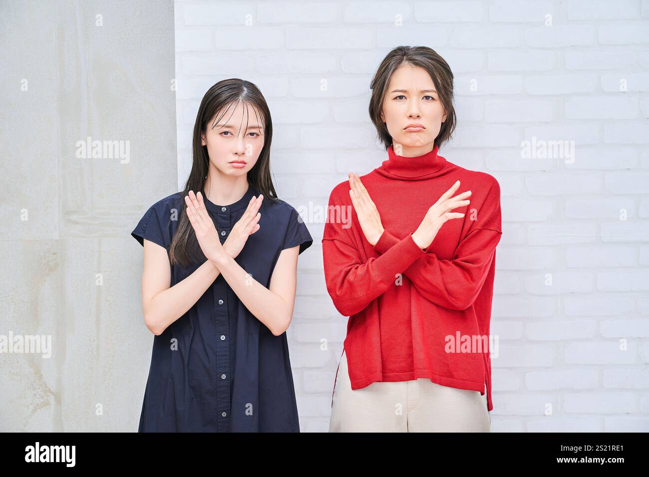Two women rejecting Stock Photo - Alamy