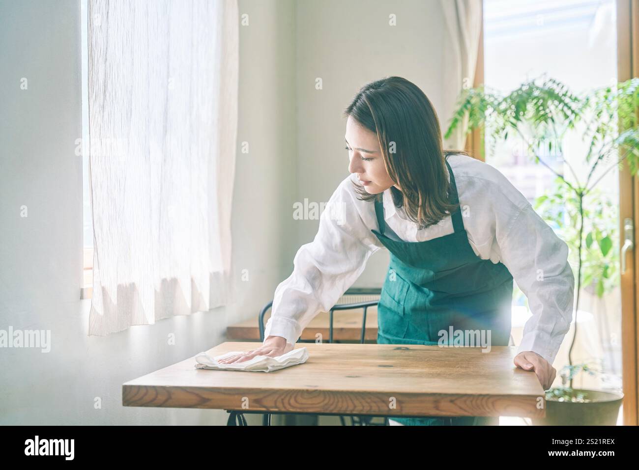 Table wearing hi-res stock photography and images - Alamy