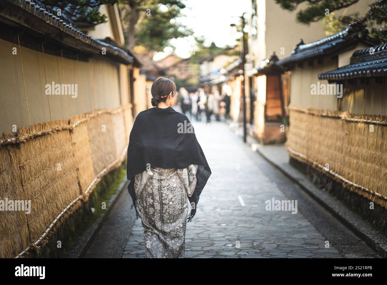 Woman sightseeing in the ruins of the Naga-machi samurai residence in ...