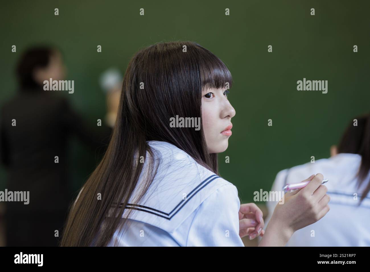 High school student looking outside during class Stock Photo - Alamy