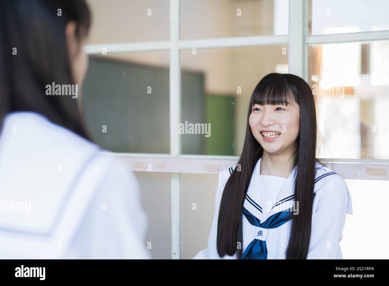 High school student talking with classmates at school Stock Photo - Alamy