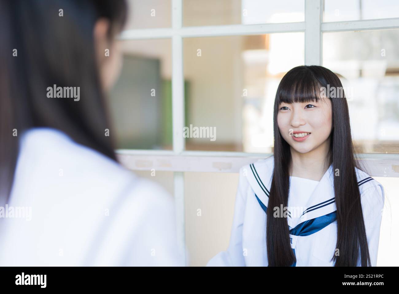 High school student talking with classmates at school Stock Photo - Alamy