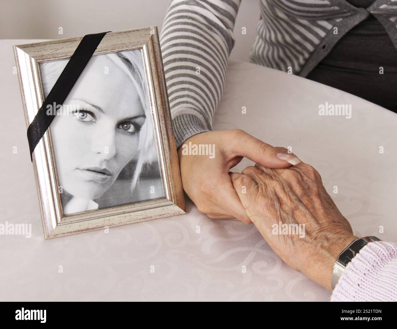 Holding hands for comfort. Mourning in the event of death. Austria ...