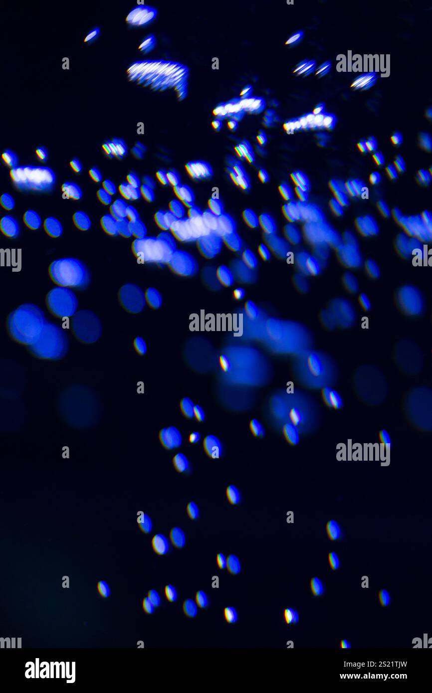 Blue shimmering bubbles in the water Stock Photo - Alamy