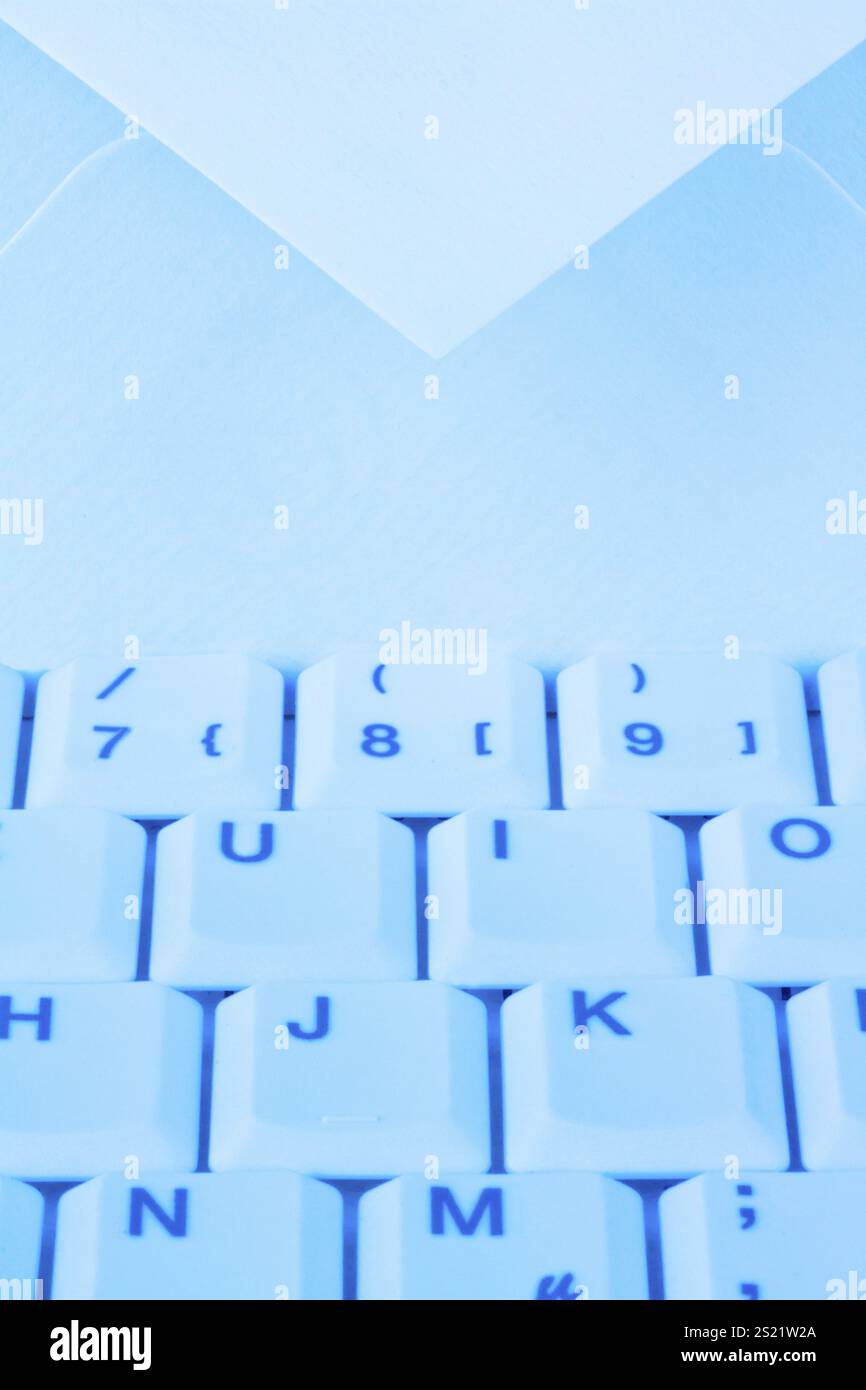The keyboard of a computer and an envelope. Communication via e-mail ...