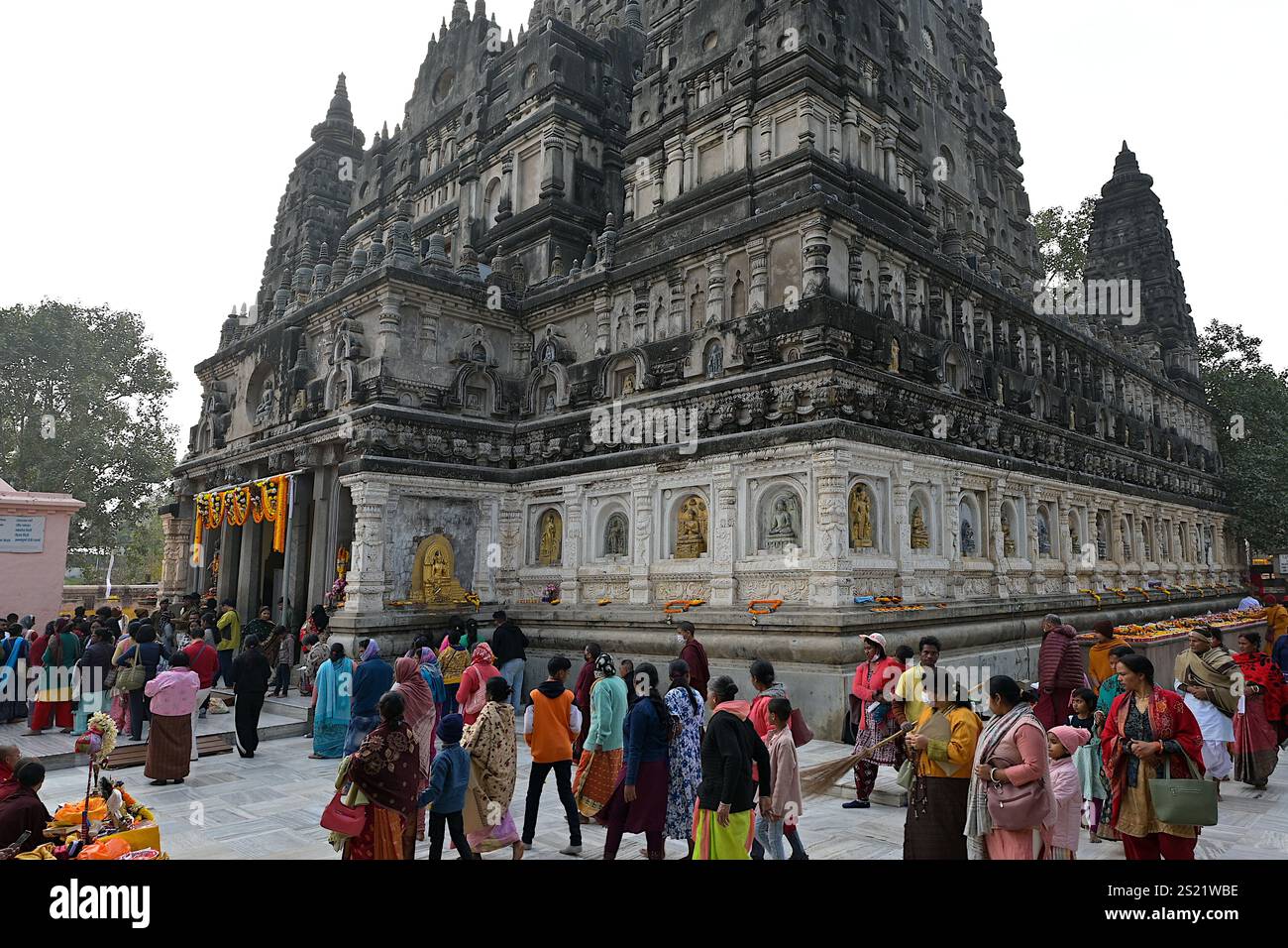 Large crowds circumambulating the Mahabodhi Temple in Bodhgaya, one of ...