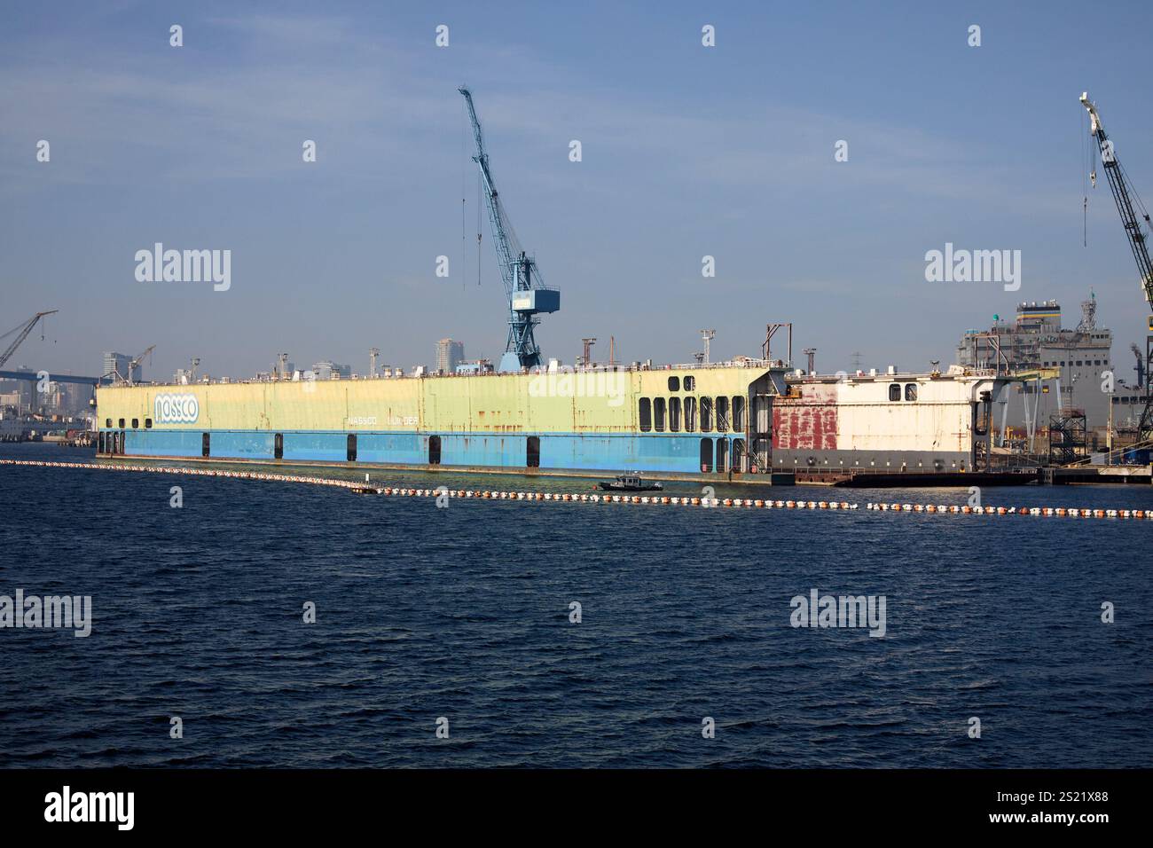 San Diego, California, USA. 21st Dec, 2024. The ''NASSCO Builder, '' a large floating dry dock ...