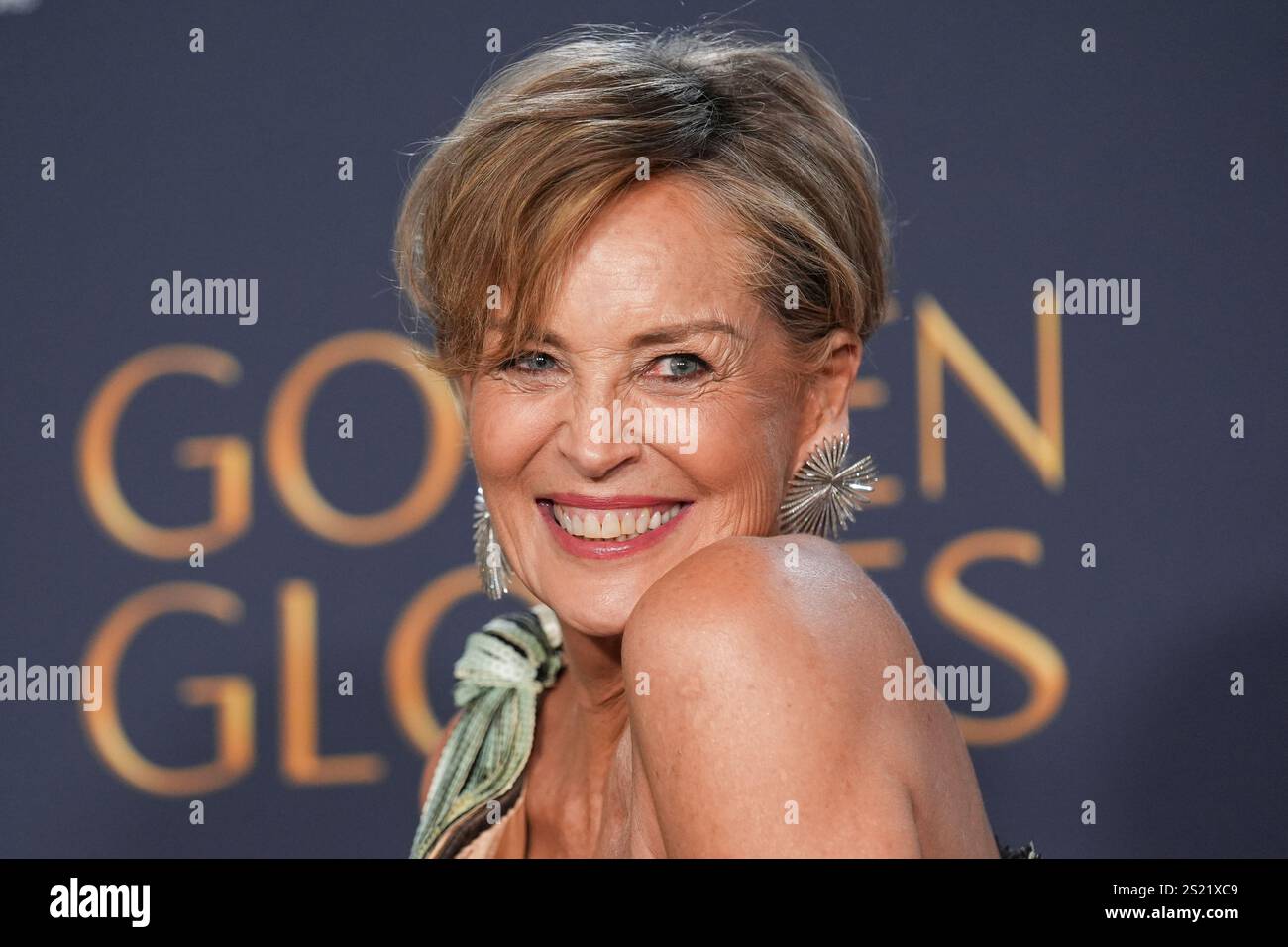 Sharon Stone poses in the press room during the 82nd Golden Globes on ...
