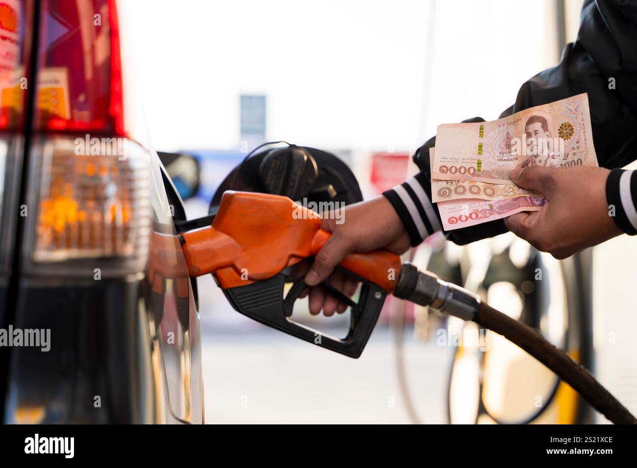 Hand puts diesel fuel pump hi-res stock photography and images - Alamy