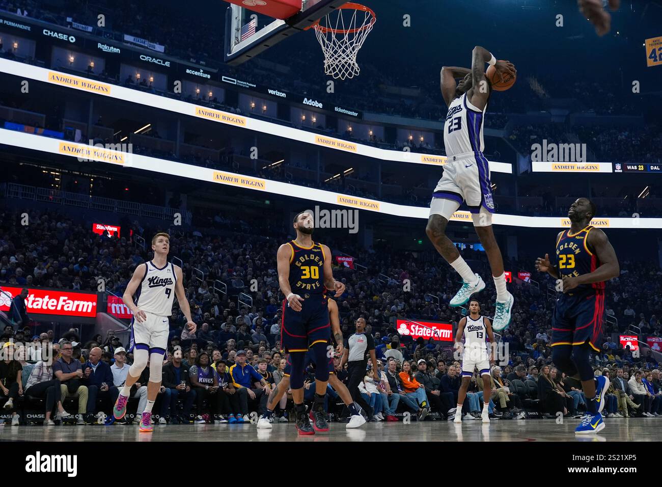 Sacramento Kings guard Keon Ellis (23) goes up to dunk in front of ...