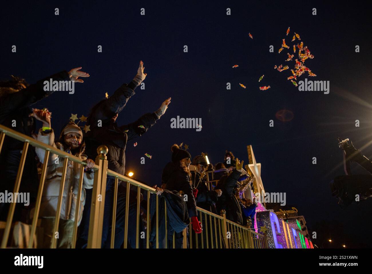 Madrid, Spain. 05th Jan, 2025. From a float its members throw candies ...