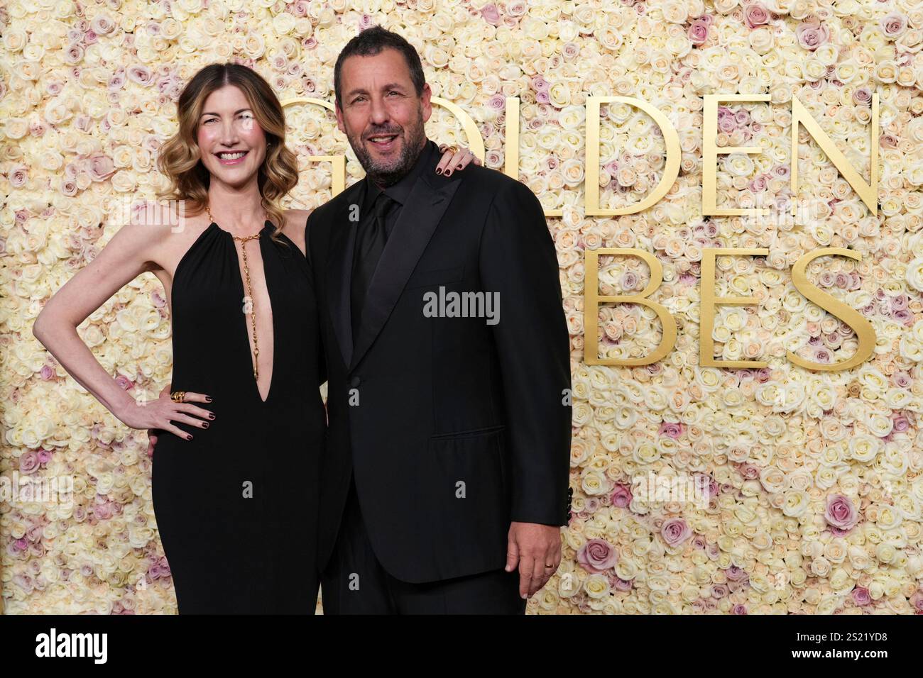 Jackie Sandler, left, and Adam Sandler arrive at the 82nd Golden Globes ...