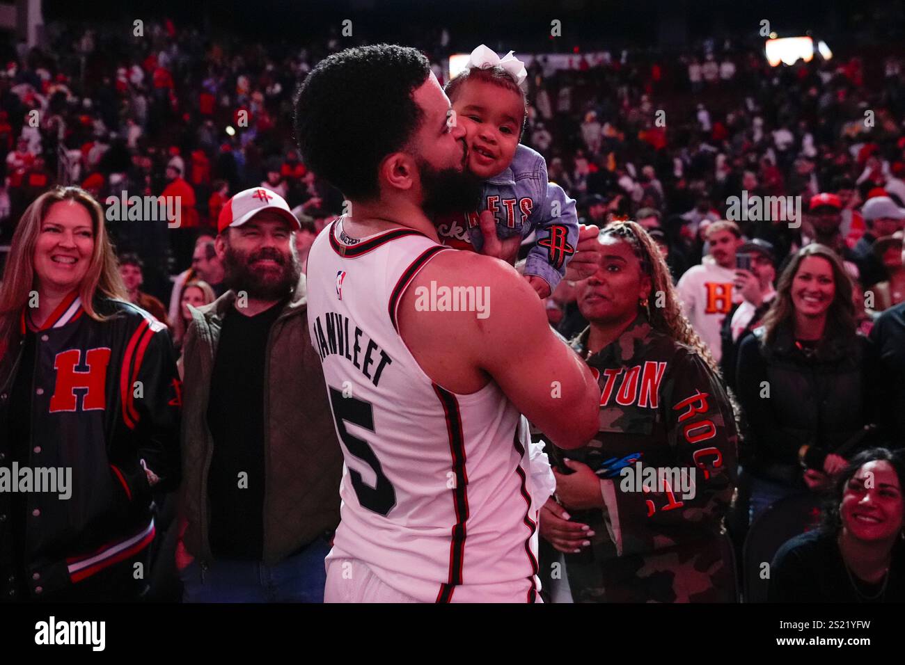 Houston Rockets guard Fred VanVleet (5) kisses his daughter after a 119-115 win over the Los ...