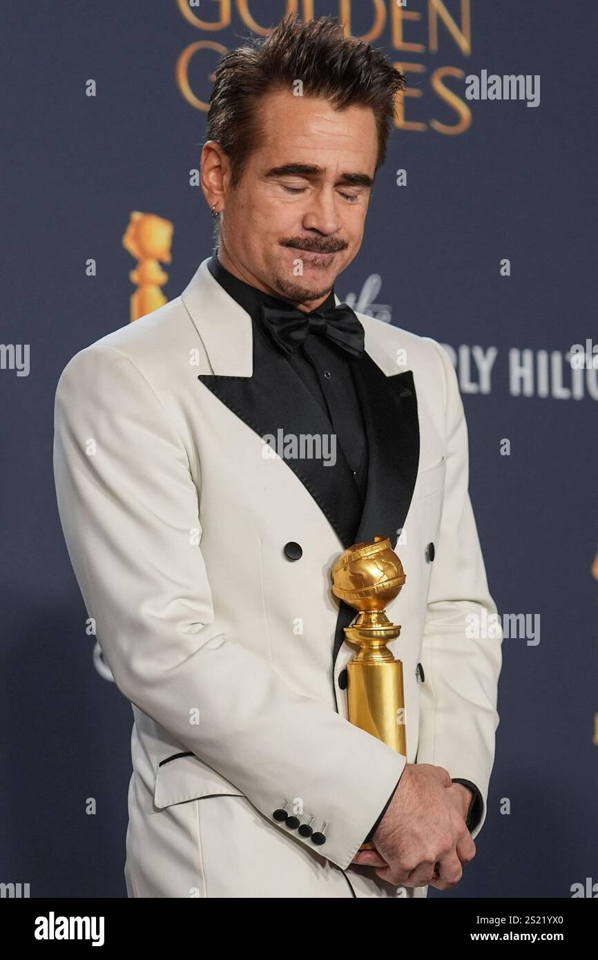 Colin Farrell poses in the press room with the award for best ...