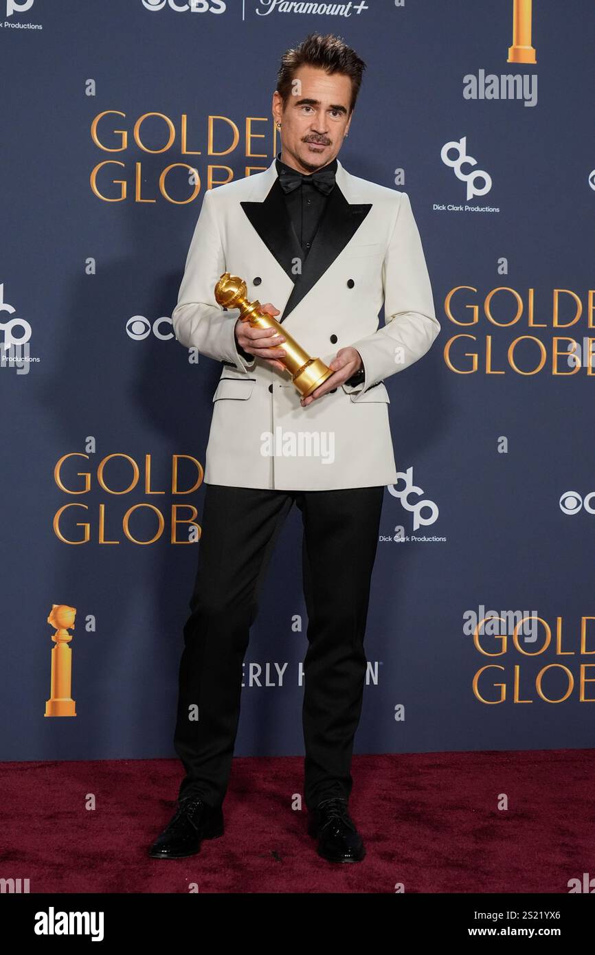Colin Farrell poses in the press room with the award for best ...