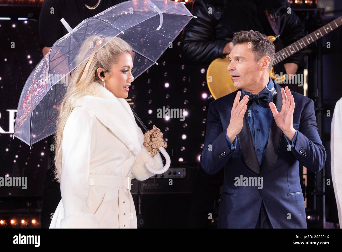 Megan Moroney and Ryan Seacrest speak on stage during Times Square New ...