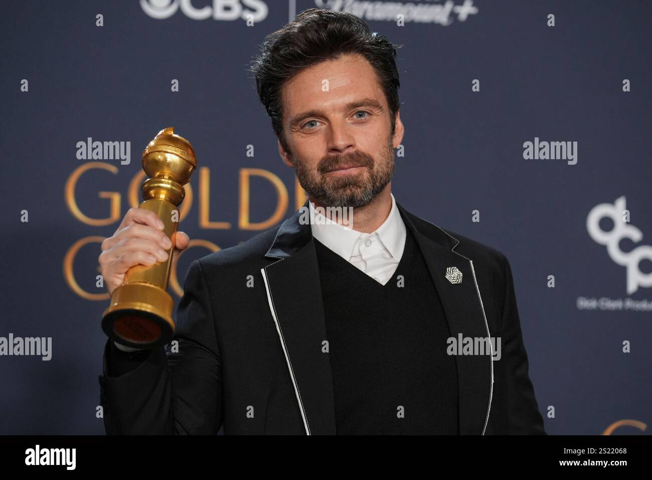 Sebastian Stan poses in the press room with the award for best ...