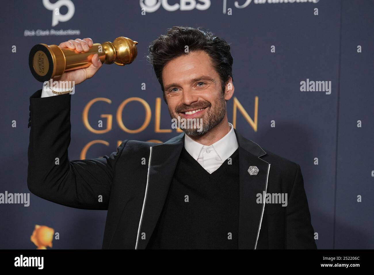 Sebastian Stan poses in the press room with the award for best ...