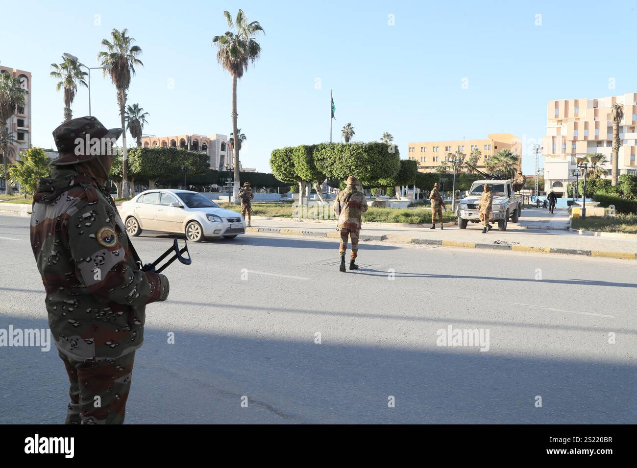 Tripoli, Libya. 5th Jan, 2025. Soldiers stand guard in the city of ...