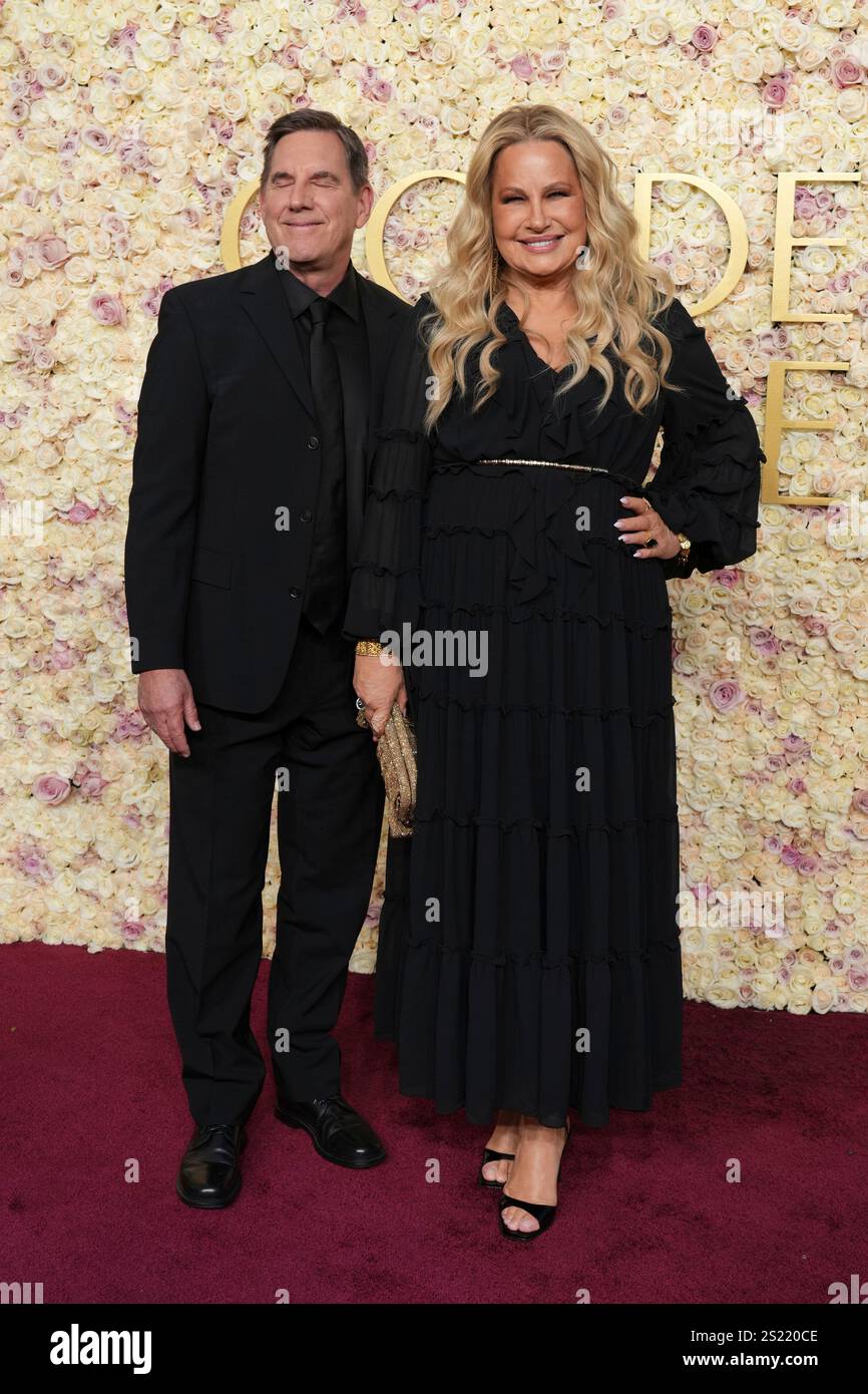 Tim Bagley, left, and Jennifer Coolidge arrive at the 82nd Golden ...