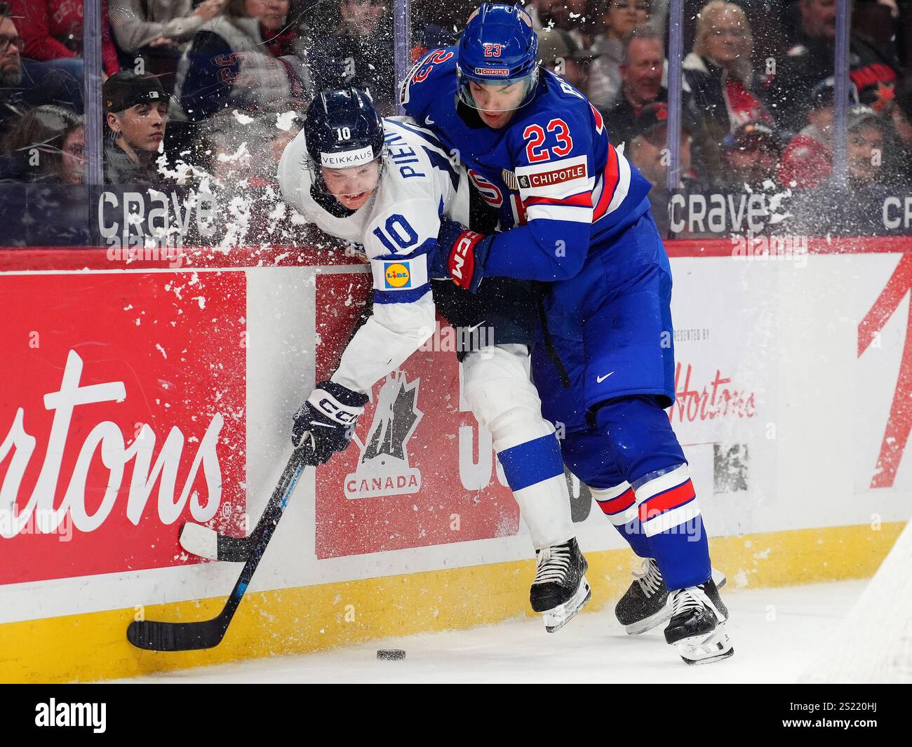 Ottawa, Canada. 05th Jan, 2025. USA forward Austin Burnevik (23) checks ...
