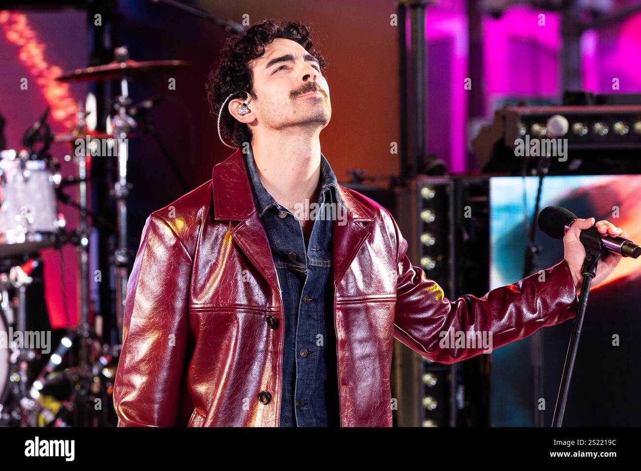 Joe Jonas of The Jonas Brothers performs on stage during Times Square ...
