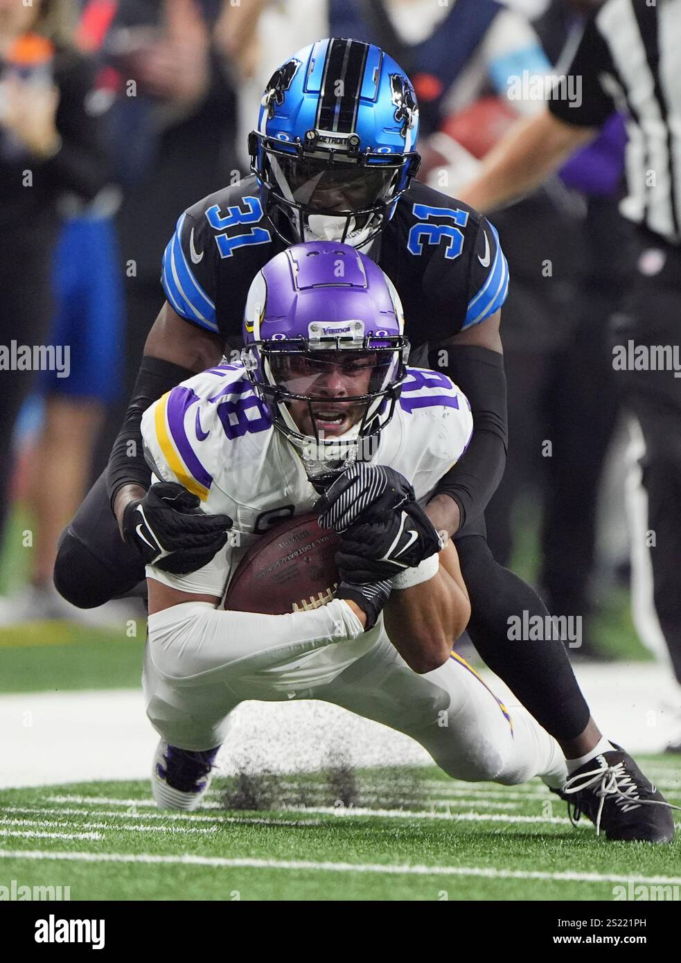 Minnesota Vikings wide receiver Justin Jefferson (18) is hit by Detroit ...