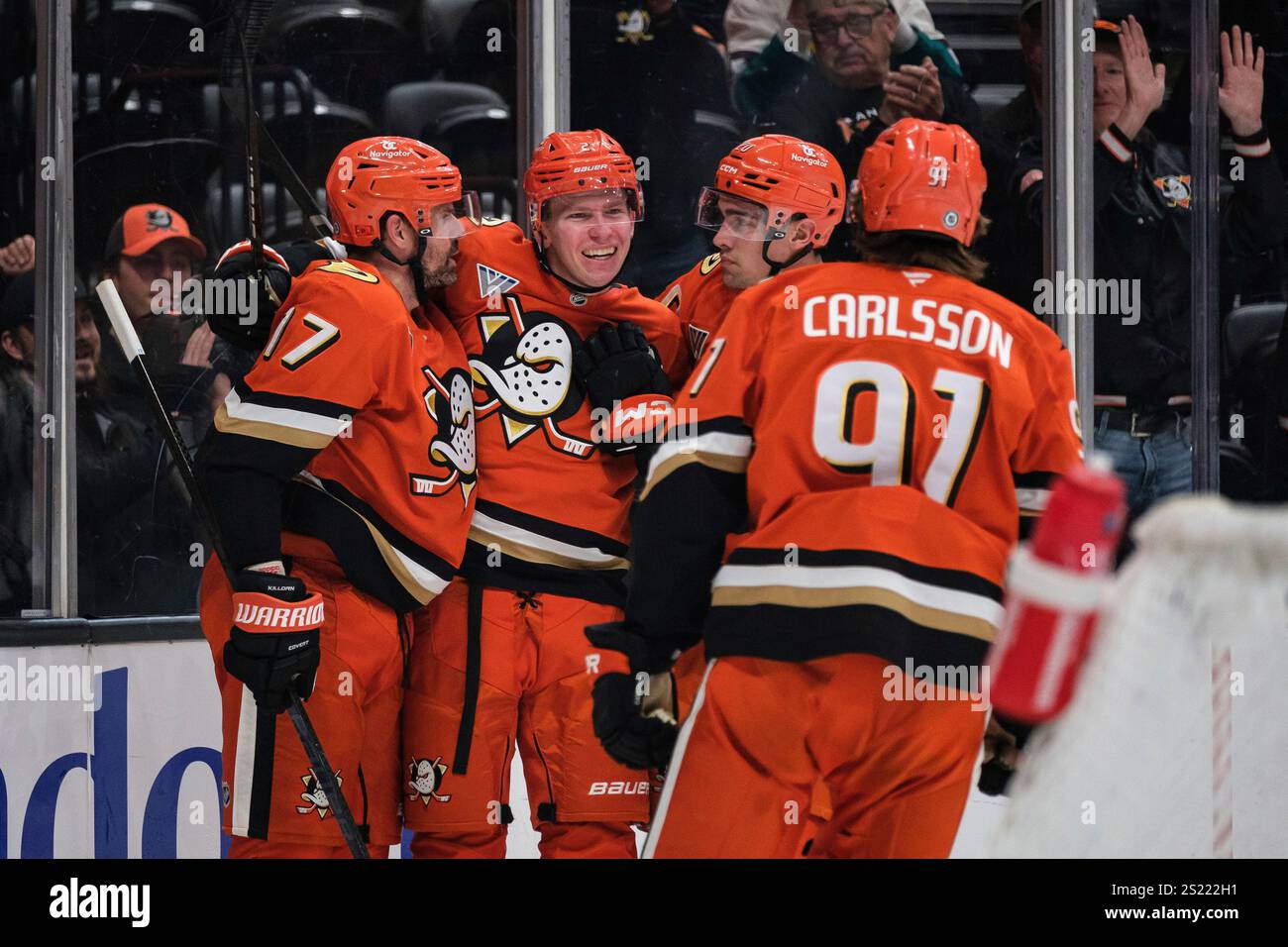 Anaheim Ducks defenseman Jackson LaCombe (2) celebrates with teammates ...