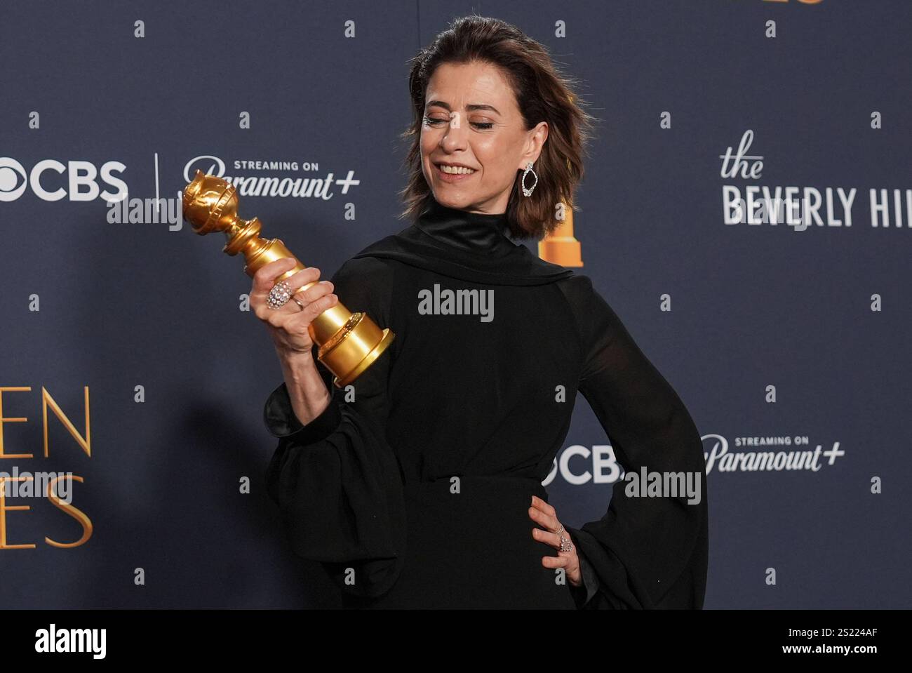 Fernanda Torres poses in the press room with the award for best ...