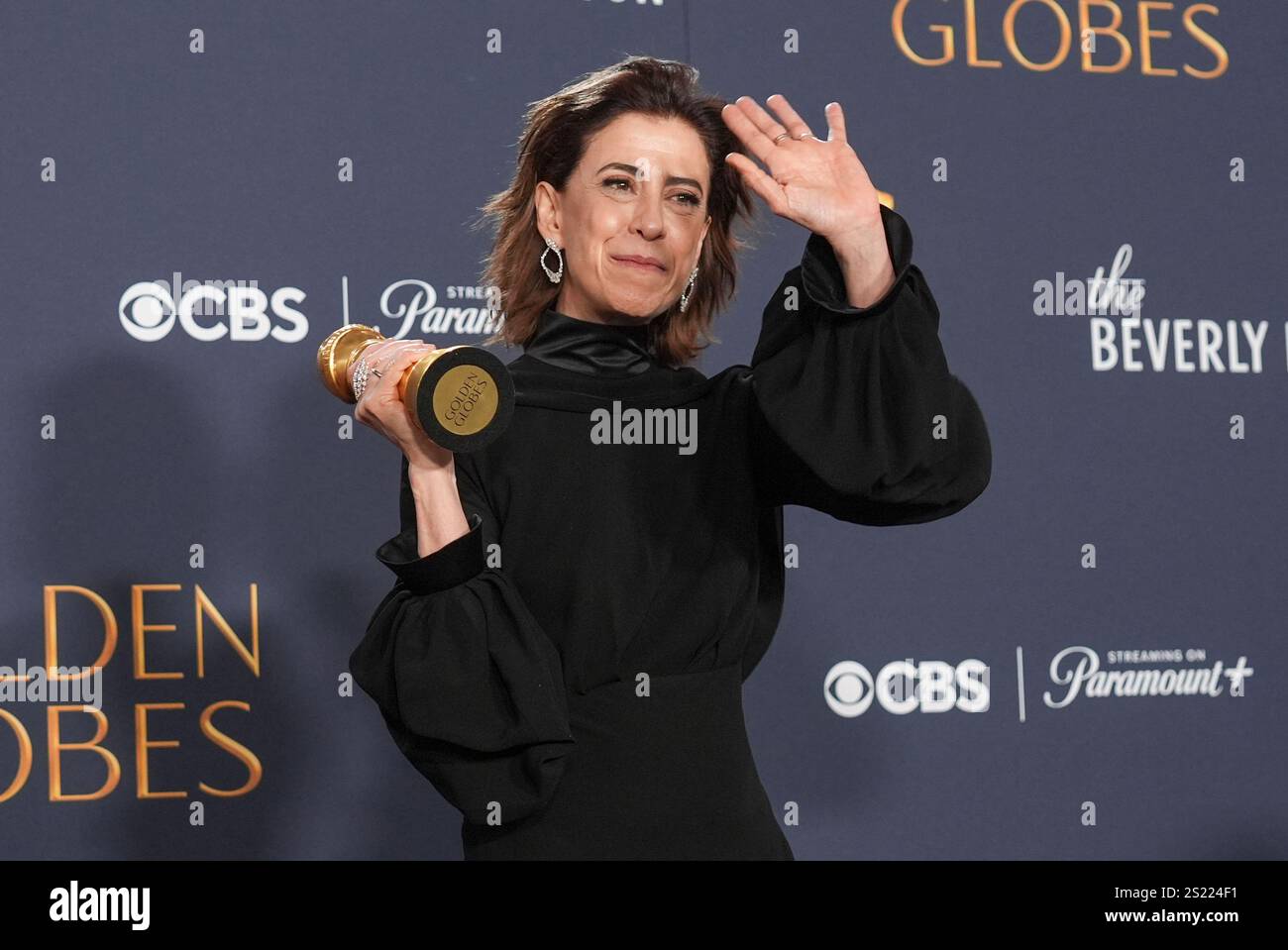 Fernanda Torres poses in the press room with the award for best ...