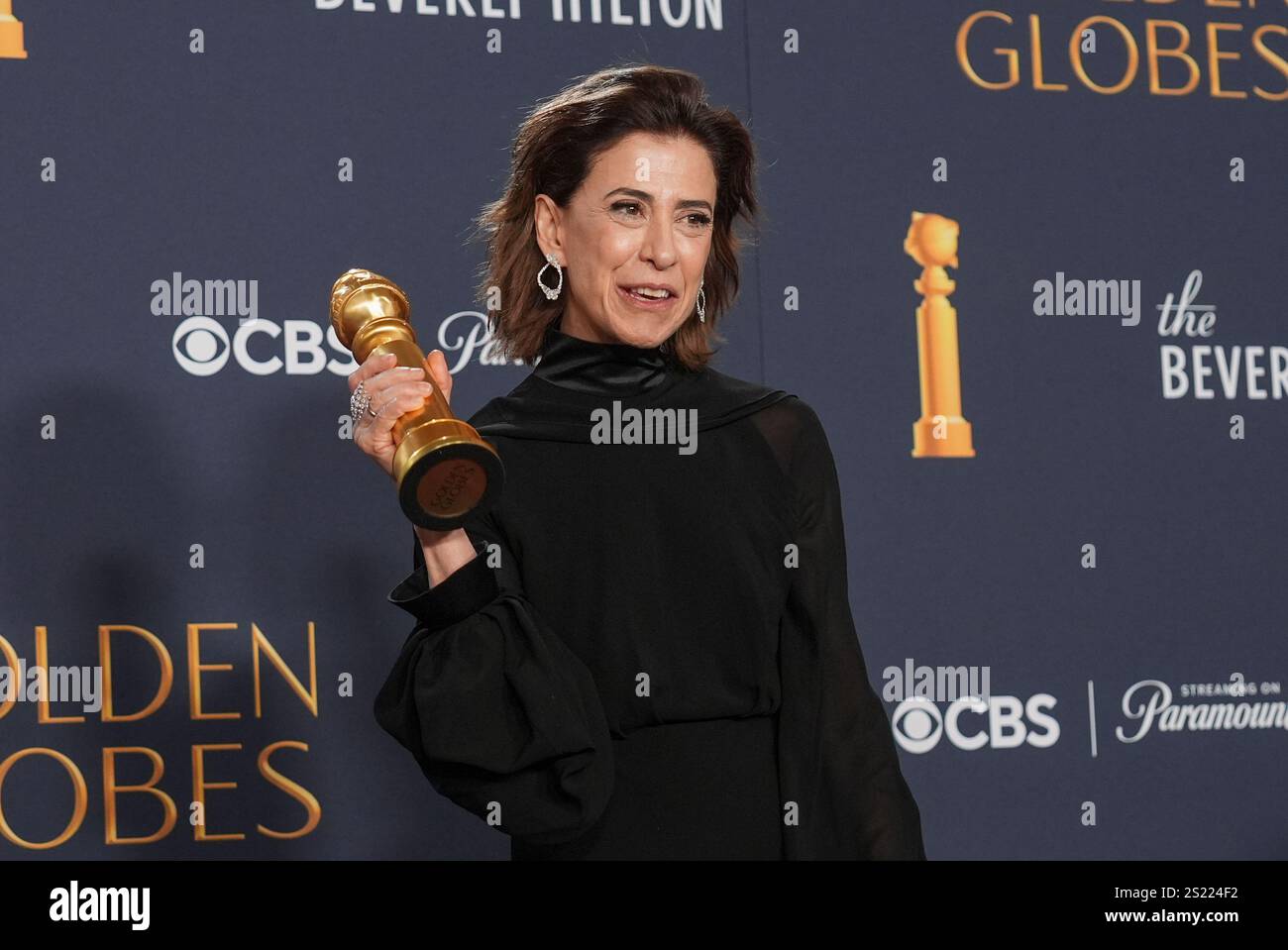 Fernanda Torres poses in the press room with the award for best ...