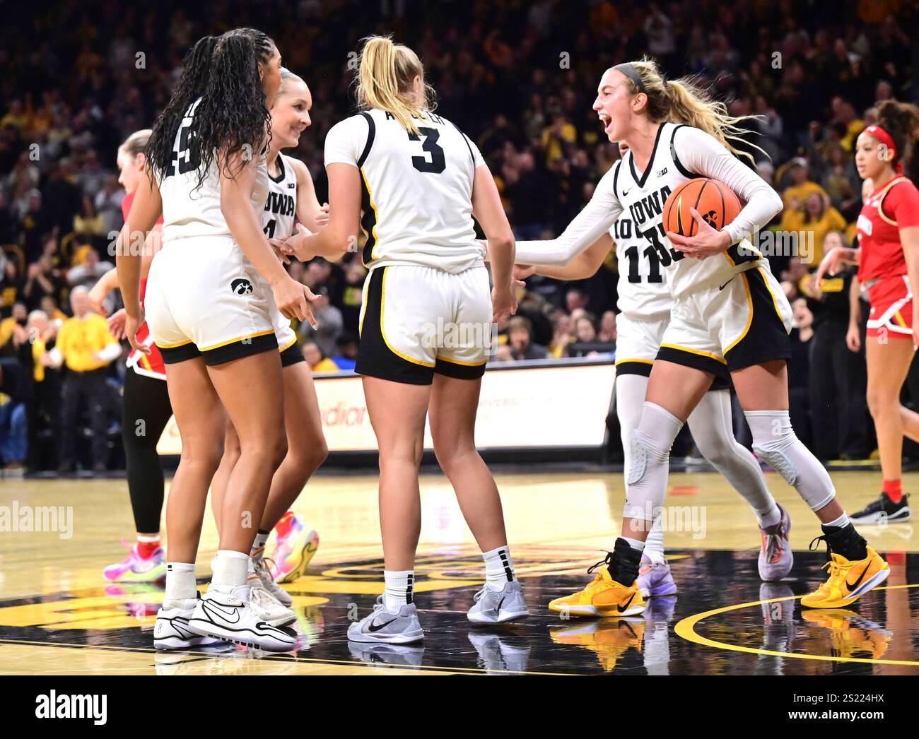 IOWA CITY, IA - JANUARY 05: Iowa players celebrate after closing the scoring gap to five points ...