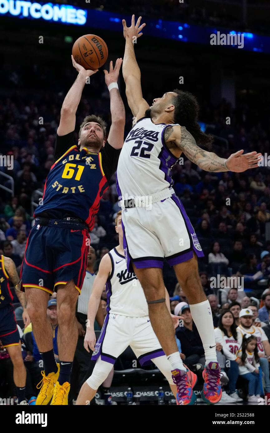 Golden State Warriors guard Pat Spencer, left, shoots while defended by ...