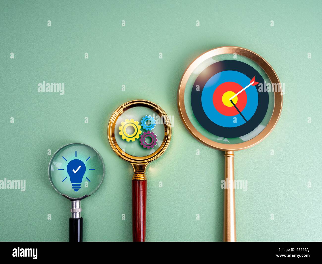 Target icon, management gears and creative light bulb symbols focused ...