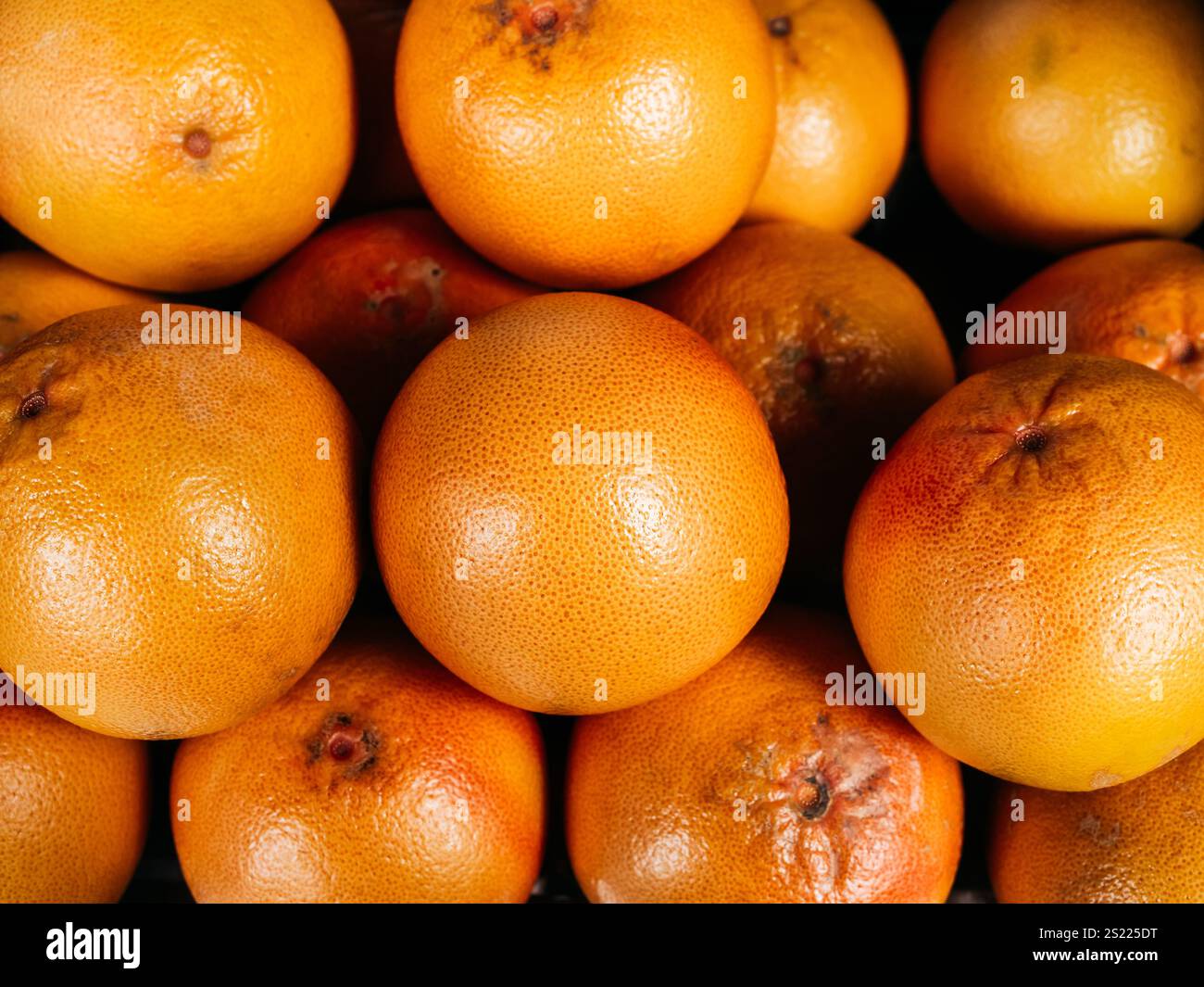Group of pile fresh oranges fruit background. Close-up peel skin of ...