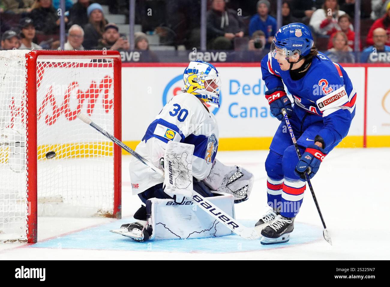 USA forward Teddy Stiga (2) scores the game-winning goal on Finland ...