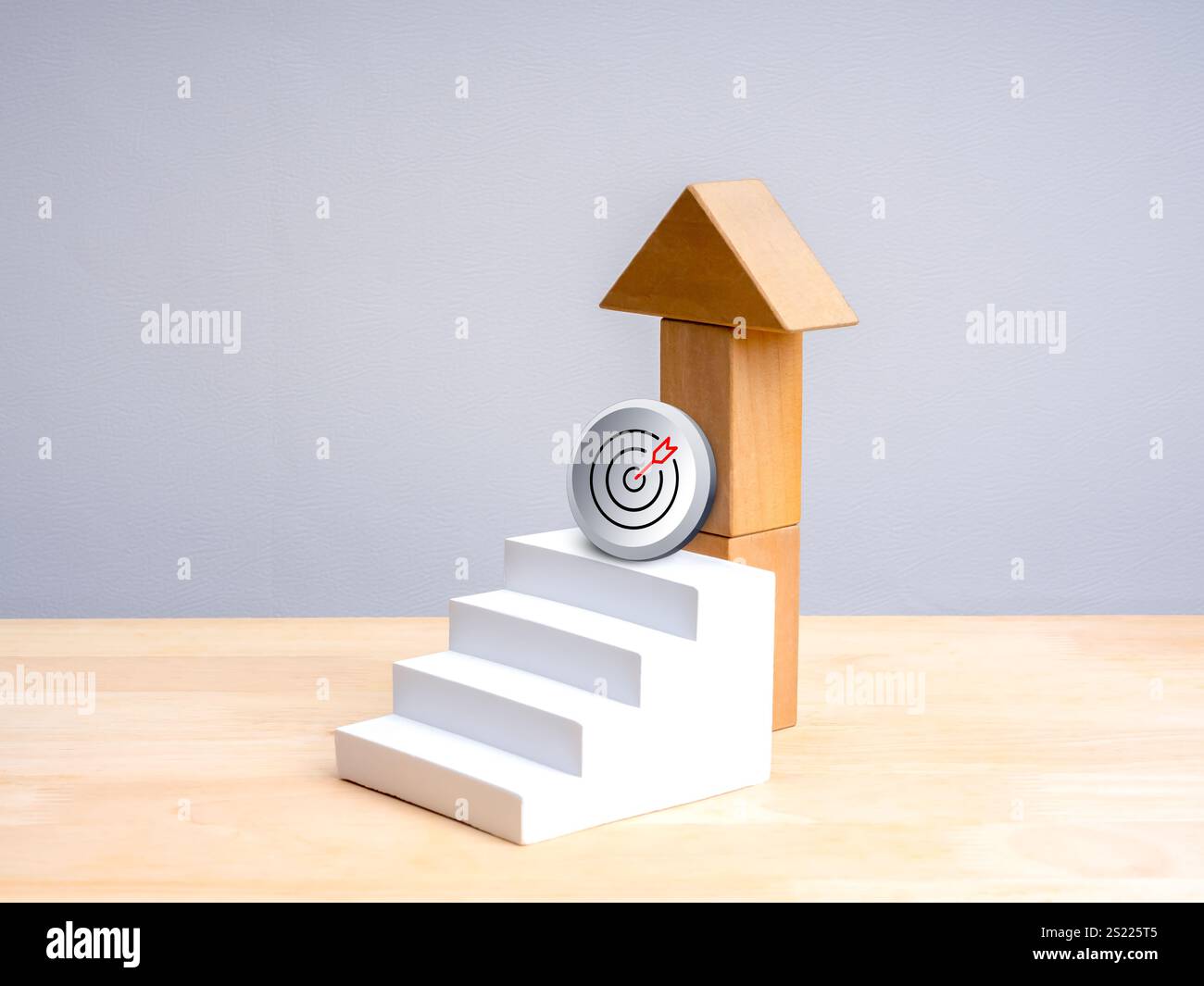 3d target icon on top of white geometric stair with wood block arranged ...