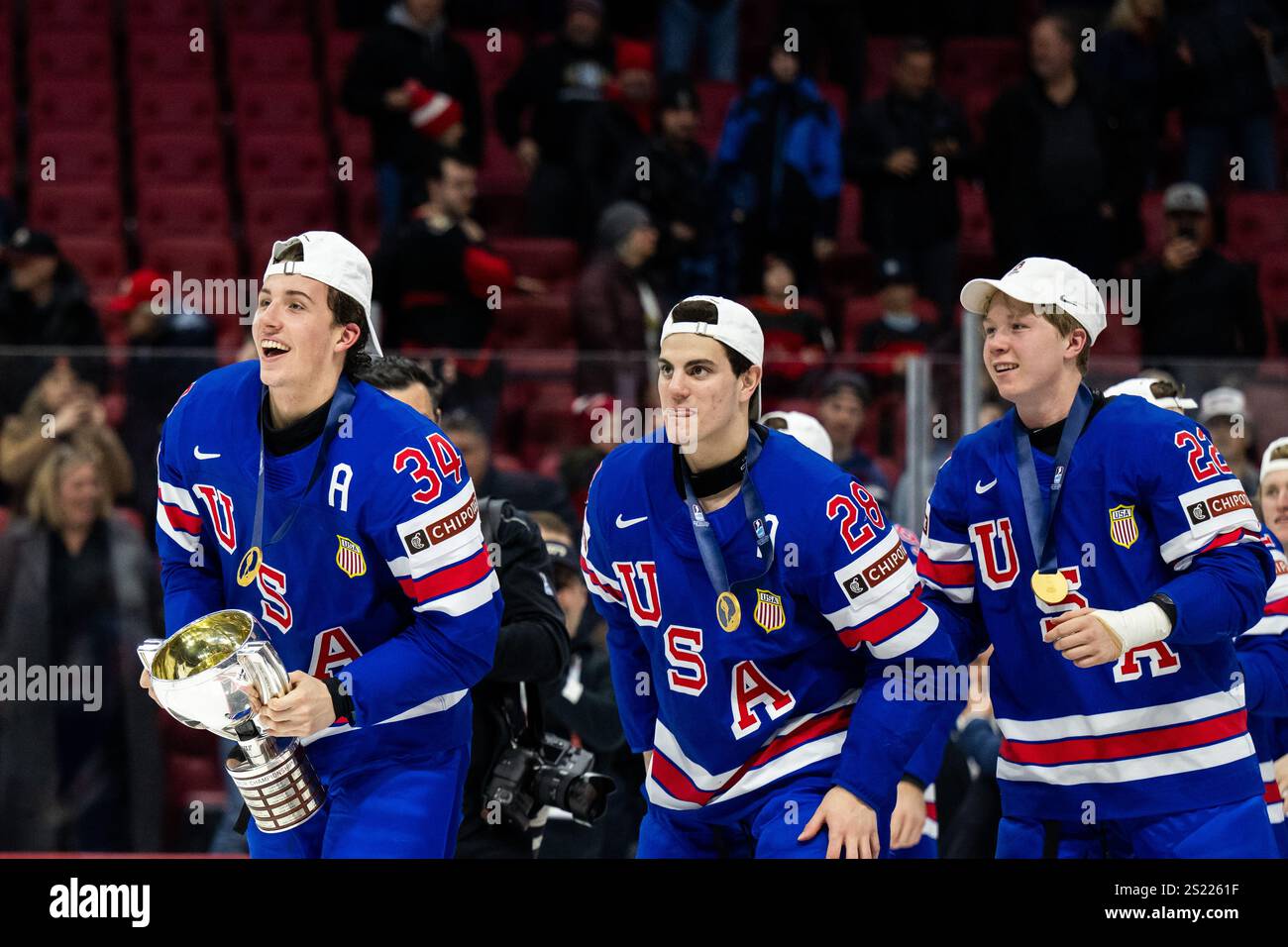 Gabe Perreault of, USA. , . celebrates with the trophy after the 2025 ...