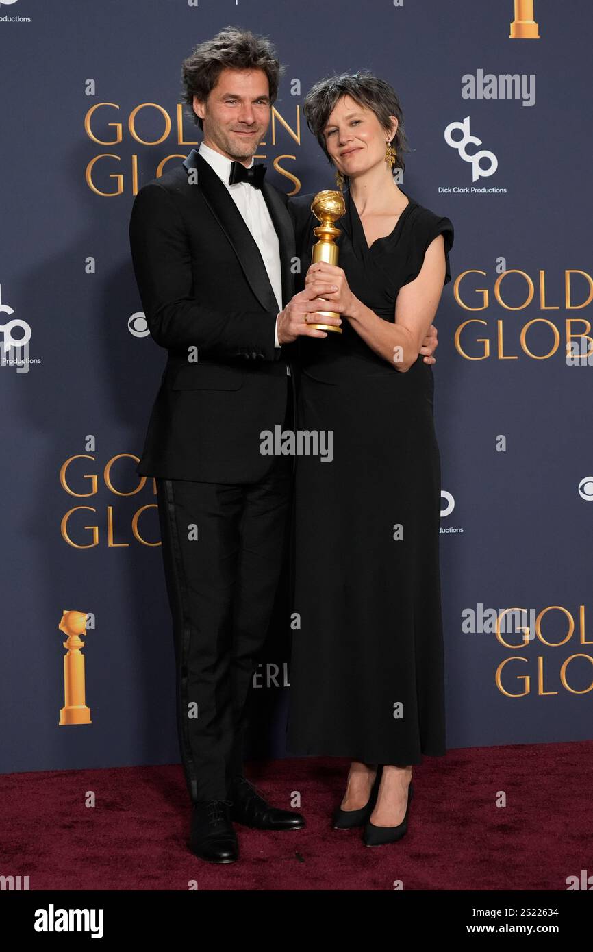 Clément Ducol, left, and Camille pose in the press room with the award ...