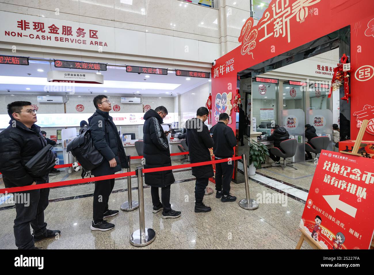 **CHINESE MAINLAND, HONG KONG, MACAU AND TAIWAN OUT** People queue to ...